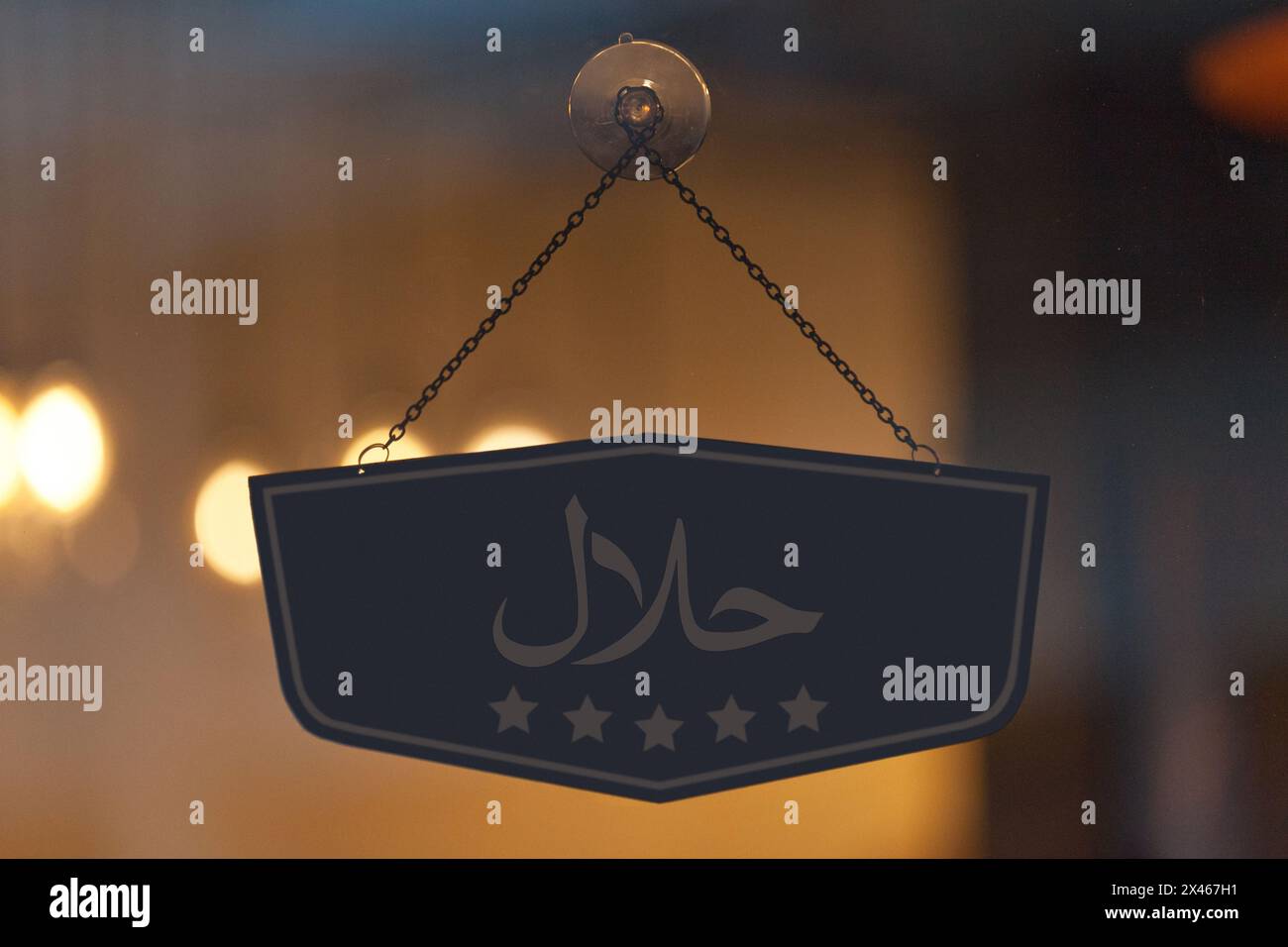 Halal sign in a window with written in Arab "حلال Stock Photo - Alamy