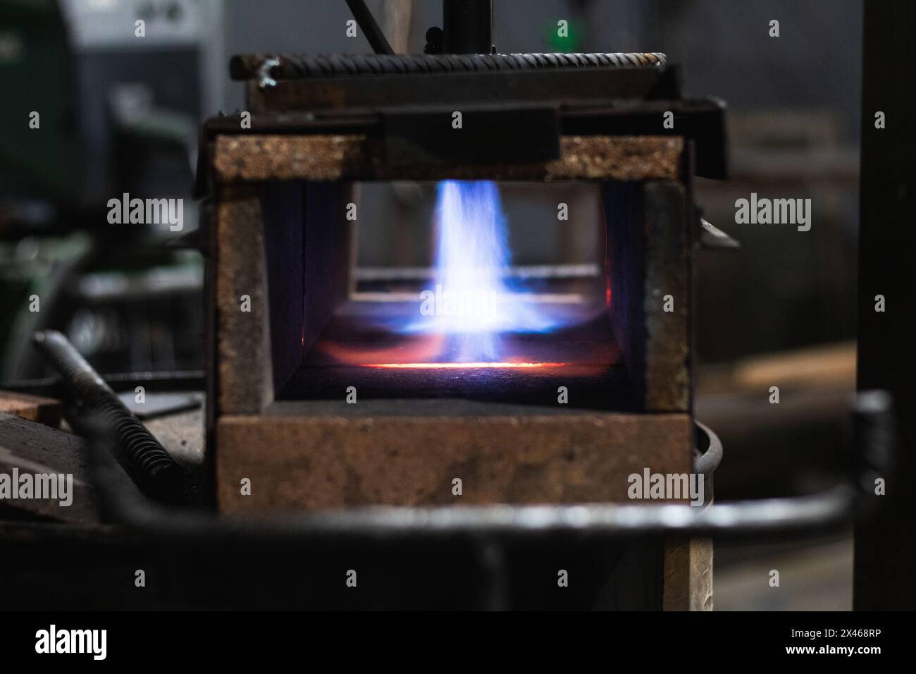 Inside of workshop for manual metal processing with gas forging furnace ...