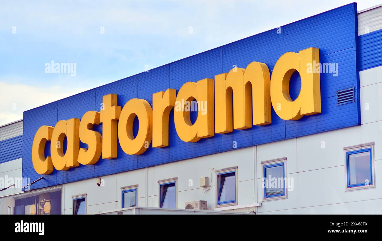 Warsaw, Poland. 28 April 2024. Signboard with brand logo of Castorama home improvement retailer ...