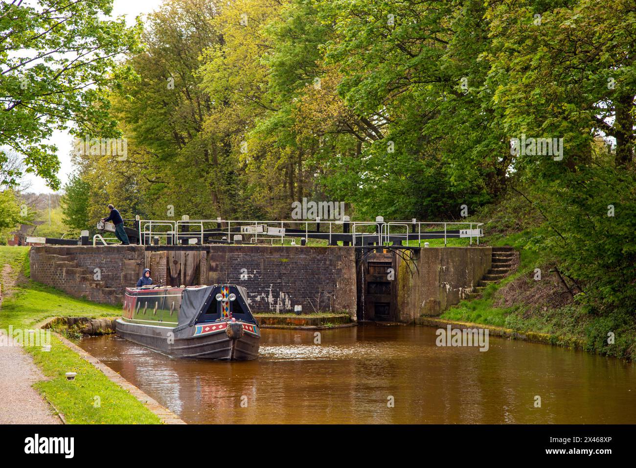 Narrowboat leaving locks hi-res stock photography and images - Alamy