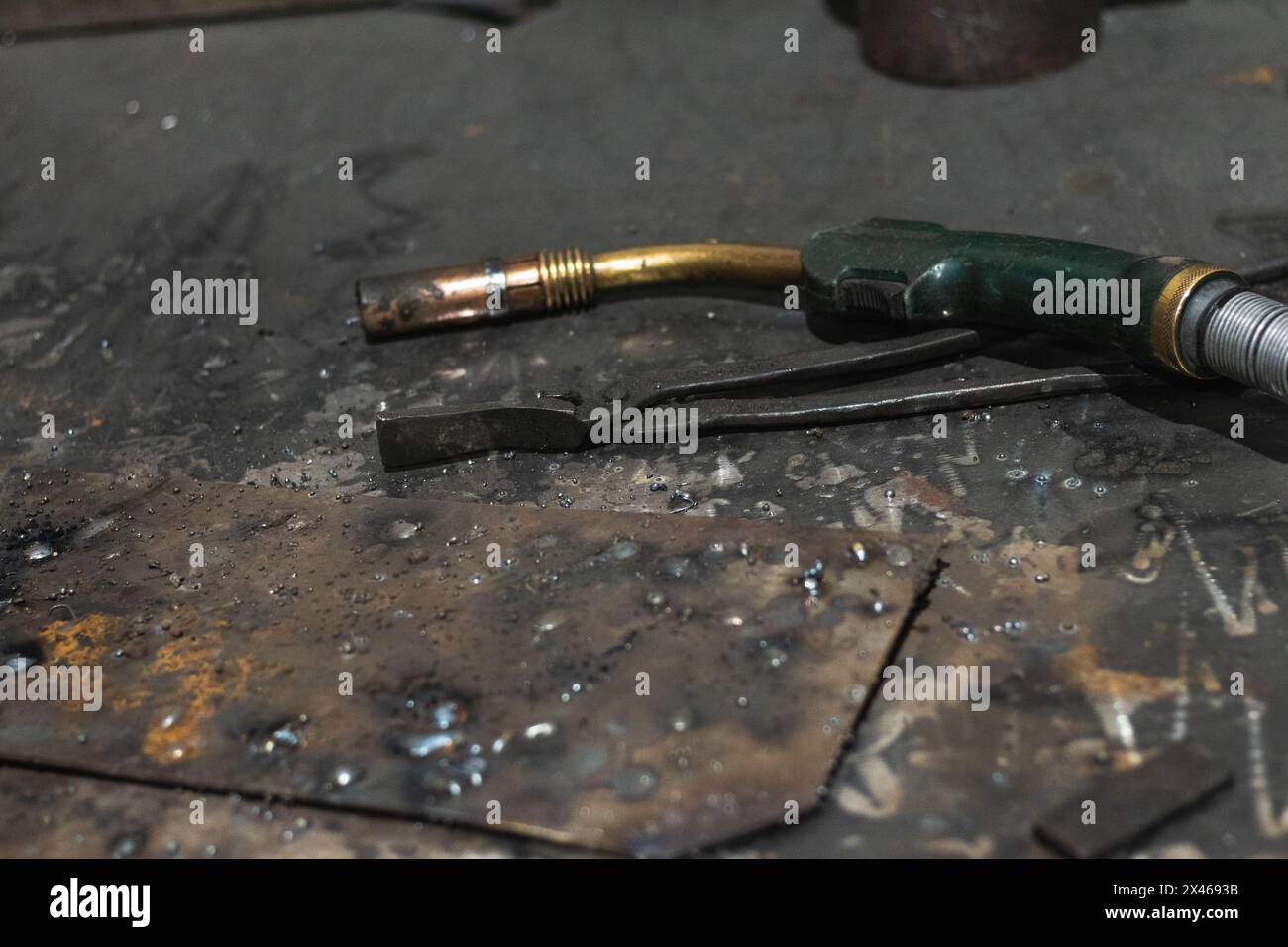 High angle of blacksmith tools consisting of welding torch and forging ...