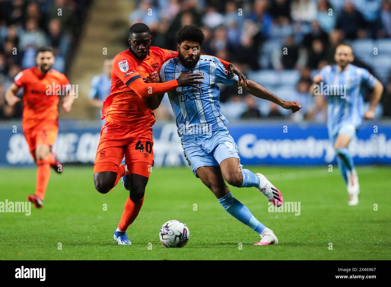 Axel Tuanzebe of Ipswich Town fouls Ellis Simms of Coventry City during ...