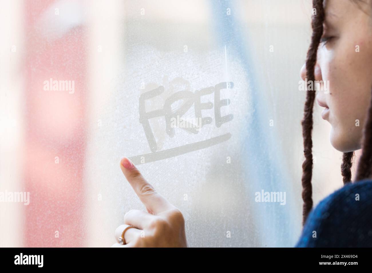 Person writing behind glass hi-res stock photography and images - Alamy