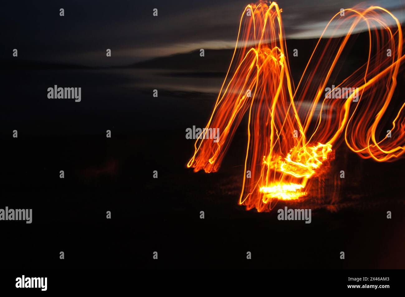 Campfire on the shore of Loch Beg on the Isle of Mull, Scotland, UK ...