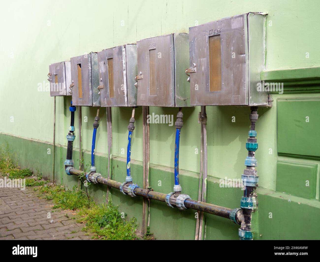 Electricity meters on the street of an Asian city. Public utilities ...