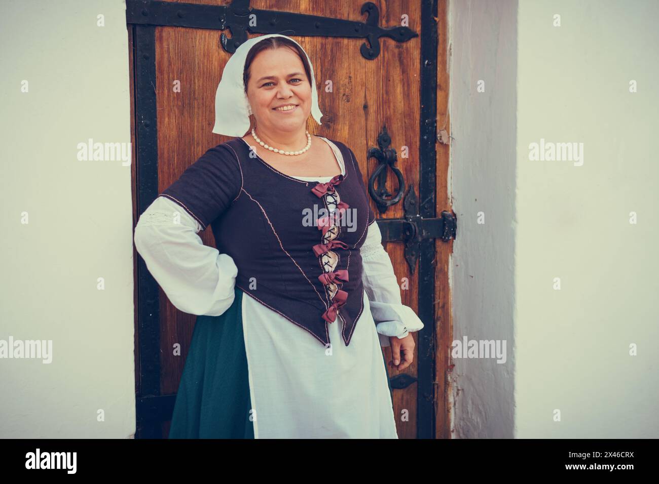 Portrait of brunette woman dressed in historical Baroque clothes with ...