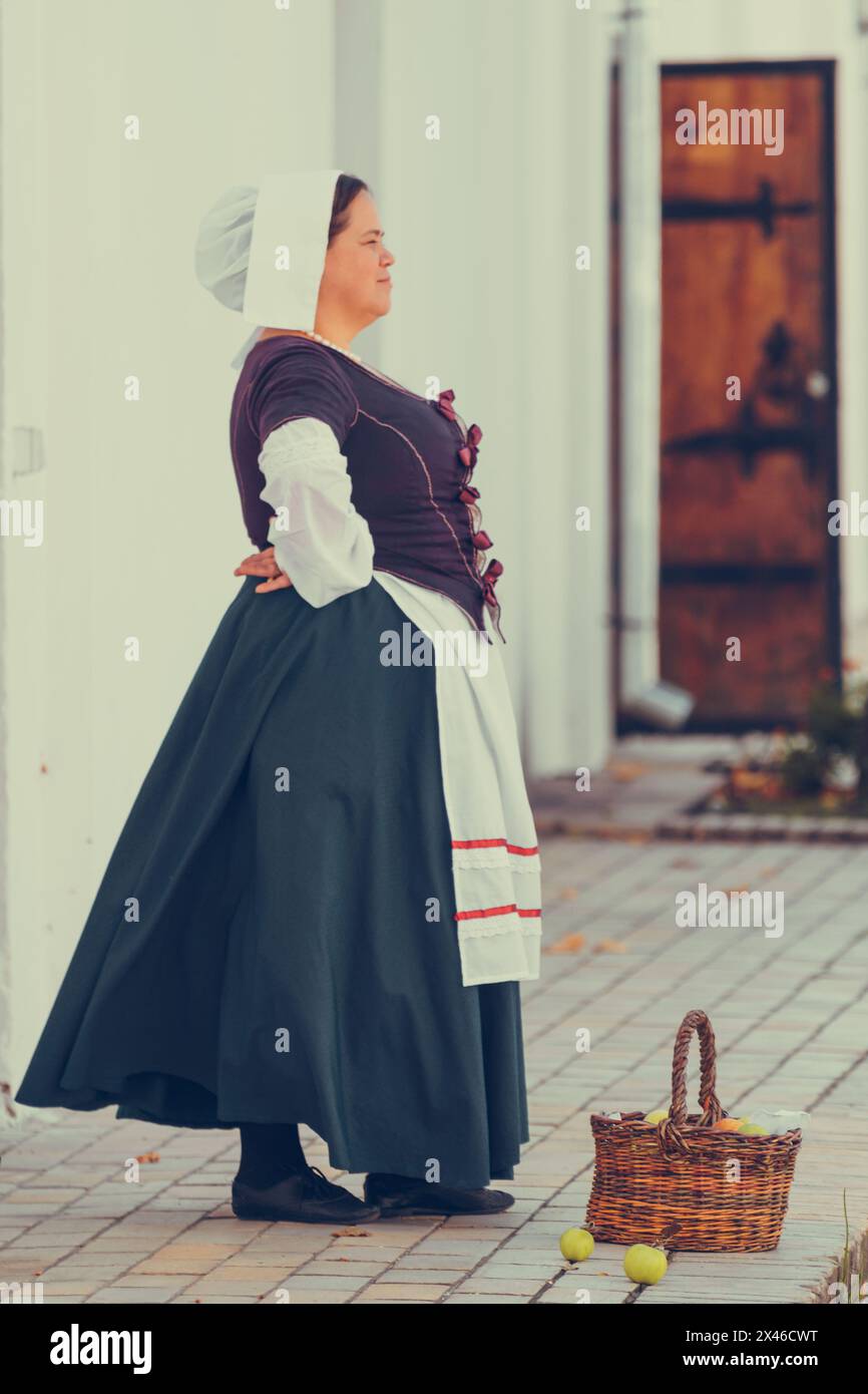 Portrait of brunette woman dressed in historical Baroque clothes with ...