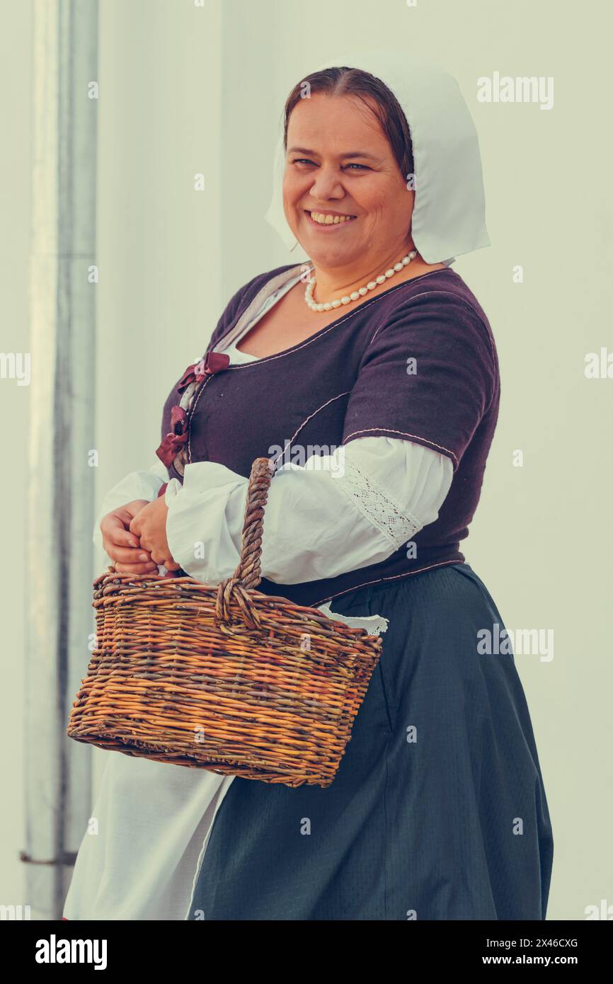 Portrait of brunette woman dressed in historical Baroque clothes with ...