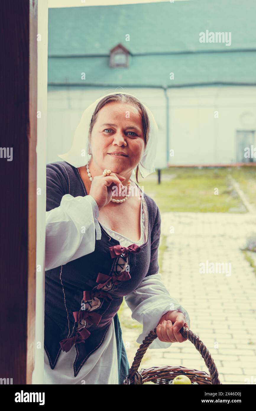 Portrait of brunette woman dressed in historical Baroque clothes with ...