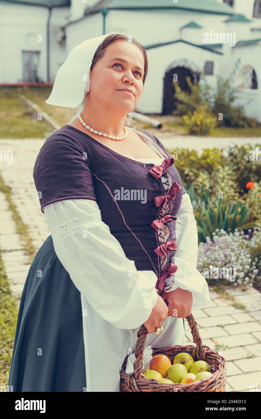 Portrait of brunette woman dressed in historical Baroque clothes with ...