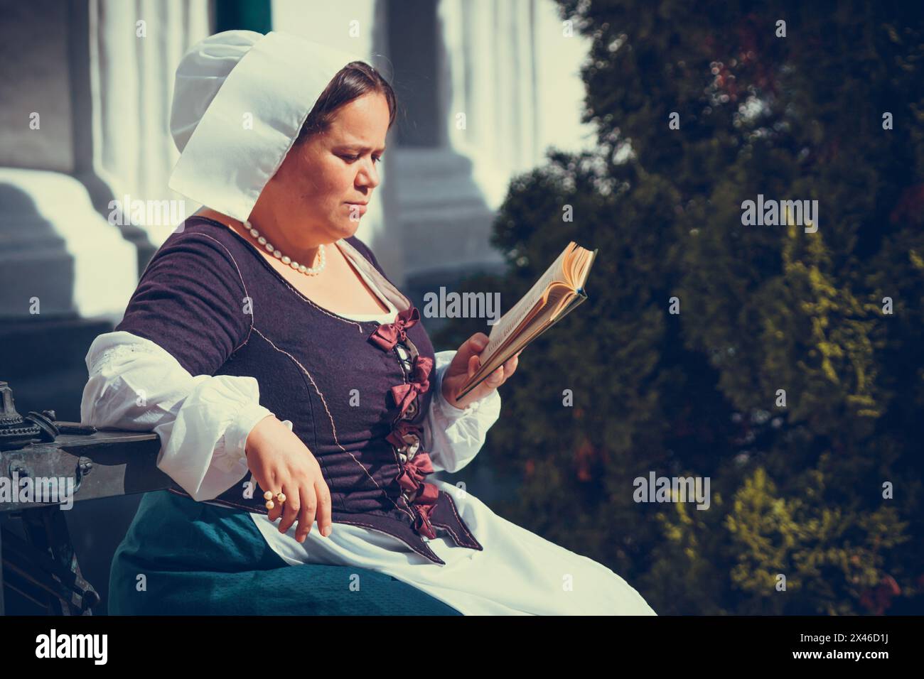 Portrait of brunette woman dressed in historical Baroque clothes with ...