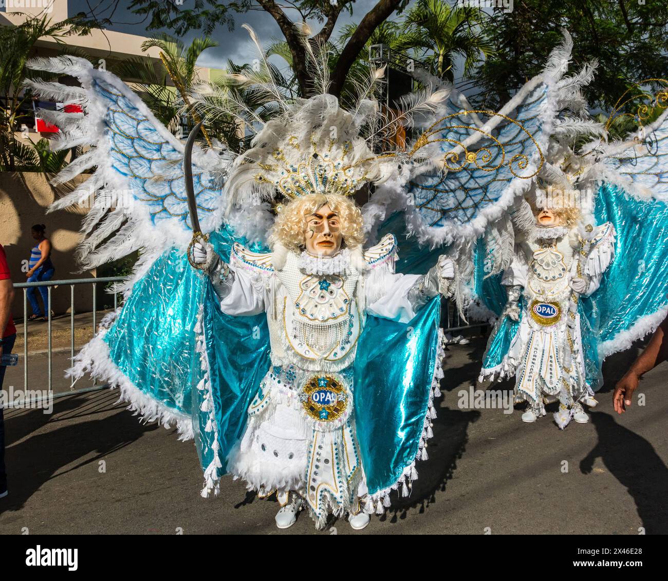 A winged angel with a sword marches in the La Vega Carnival parade. The ...