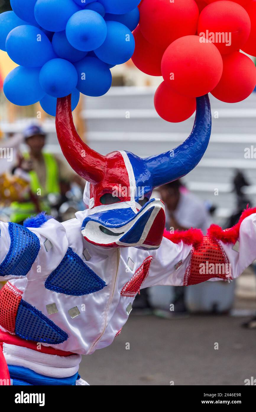 A Lechone costume from Santiago with a duck bill mask and horns in the ...