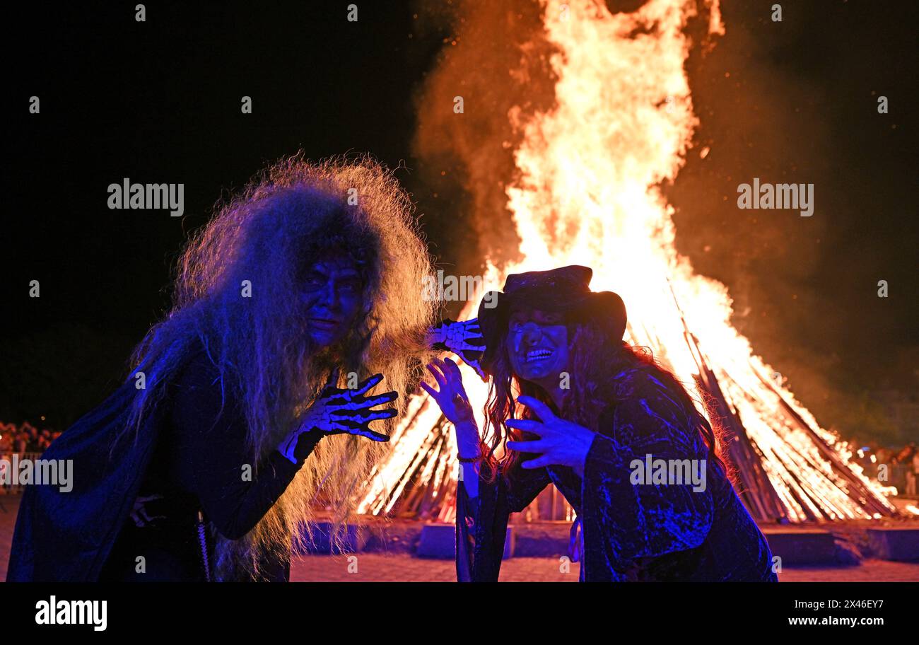 Erfurt, Germany. 30th Apr, 2024. Dressed up as devils and witches ...
