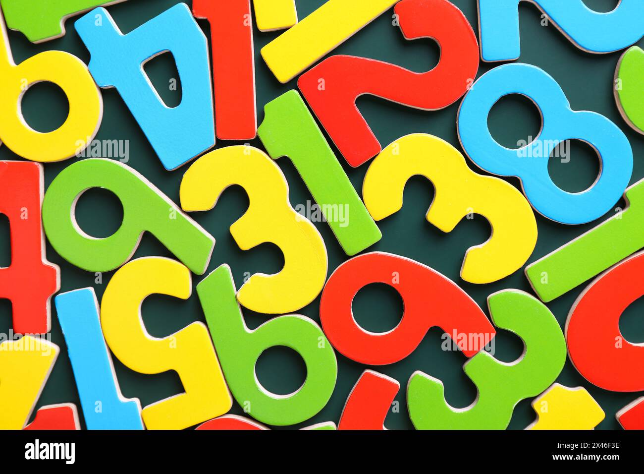 Colorful numbers on green background, top view Stock Photo - Alamy