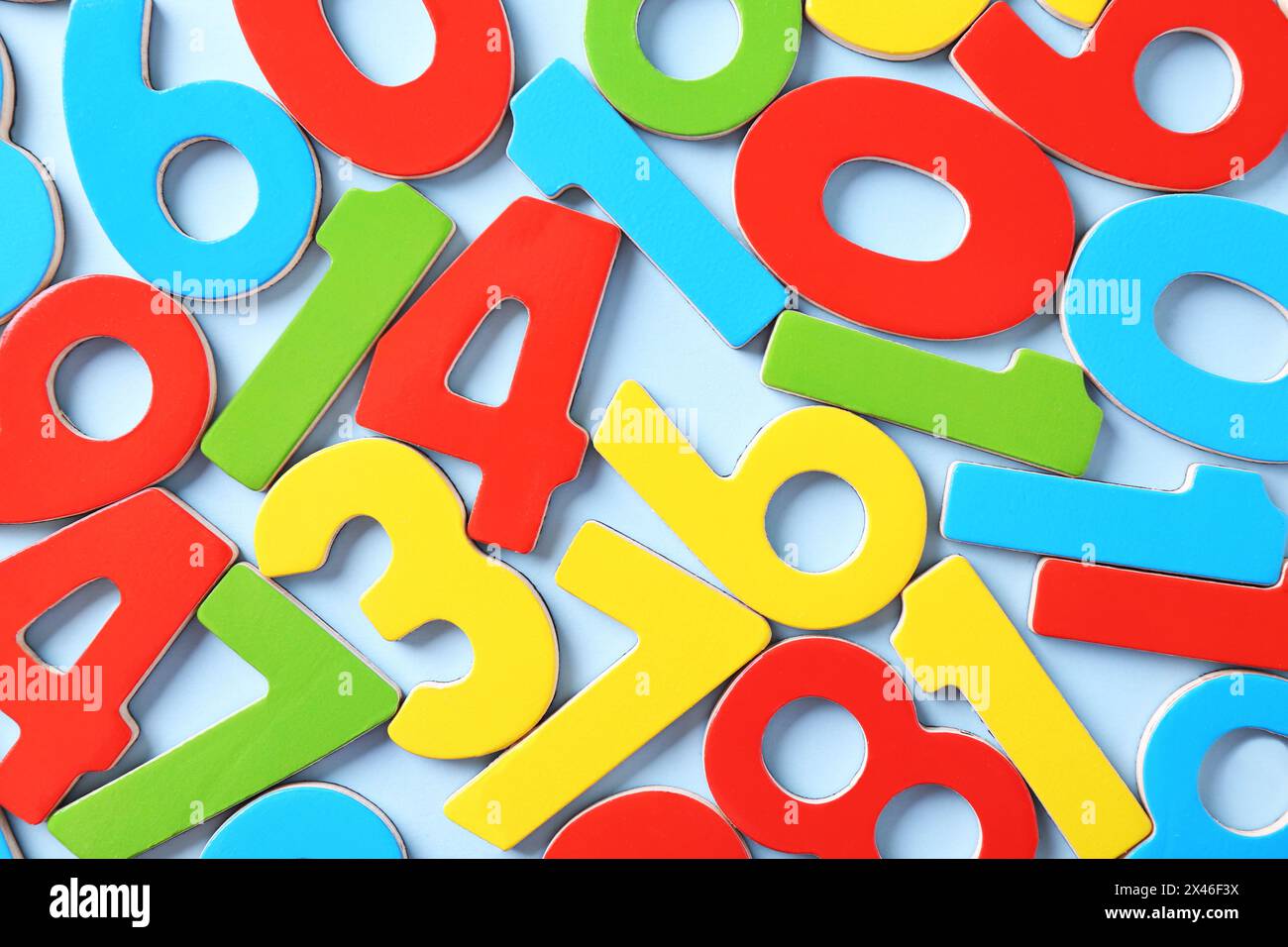 Colorful numbers on light blue background, flat lay Stock Photo - Alamy