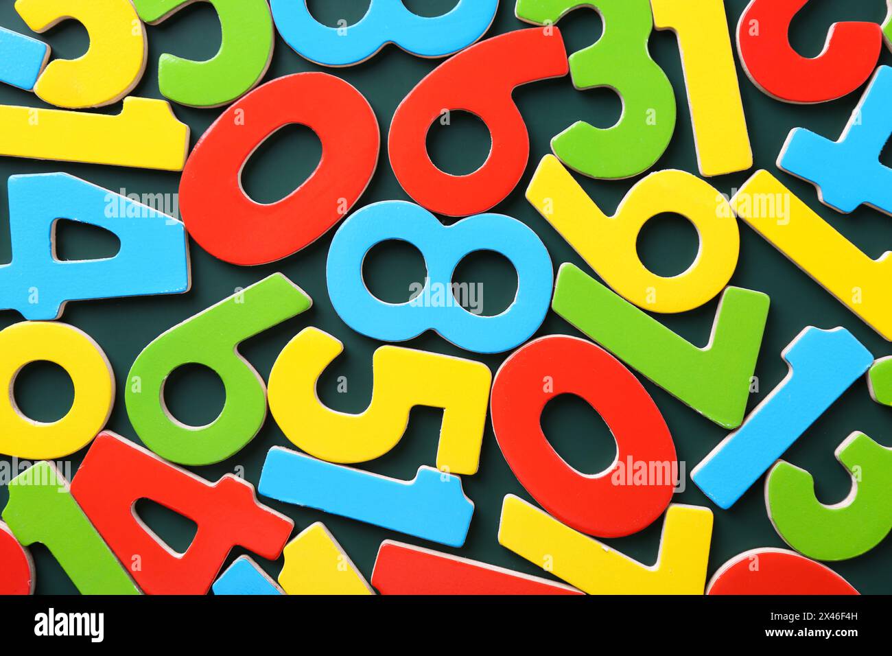 Colorful numbers on green background, top view Stock Photo - Alamy