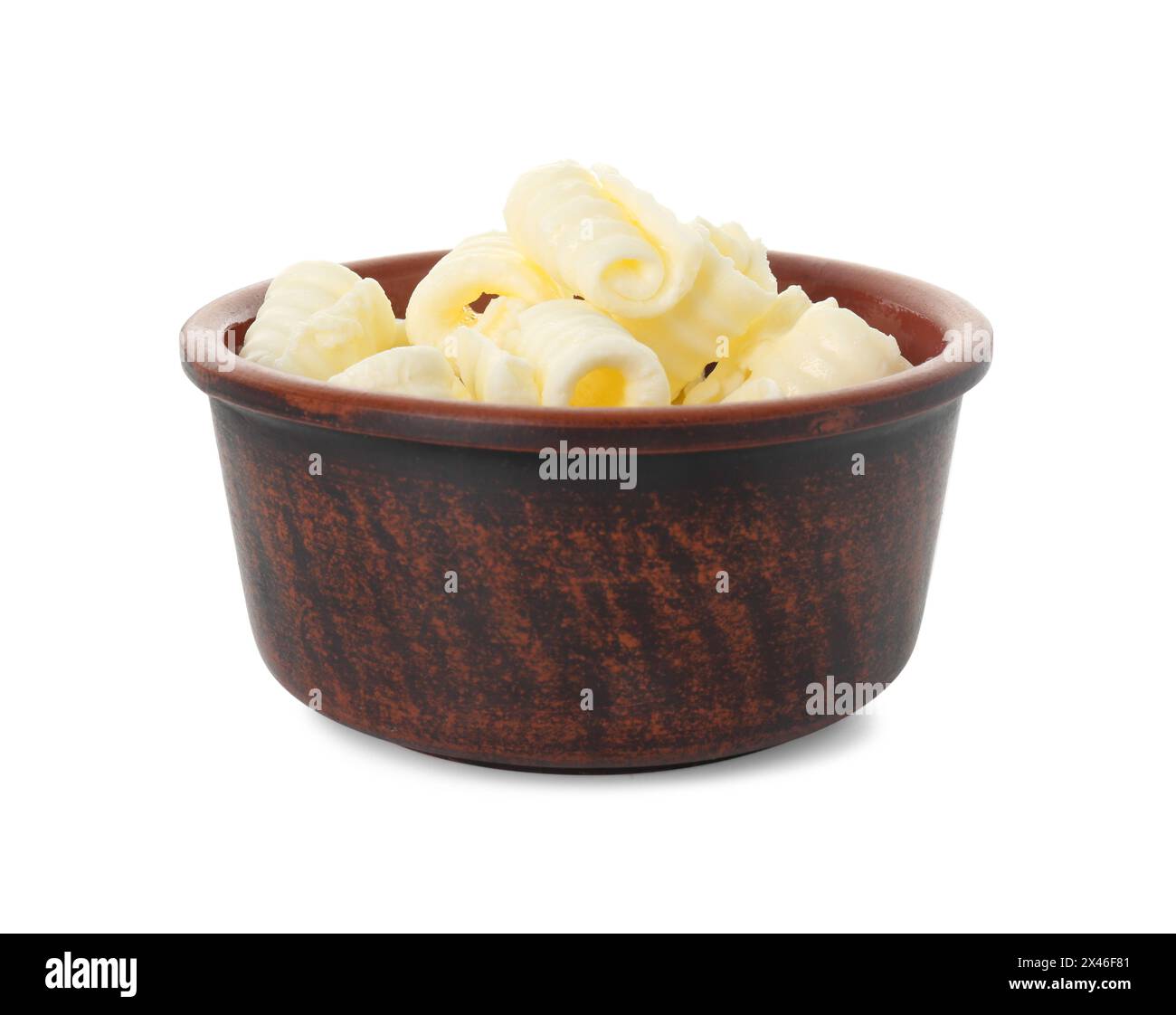 Tasty butter curls in bowl isolated on white Stock Photo - Alamy