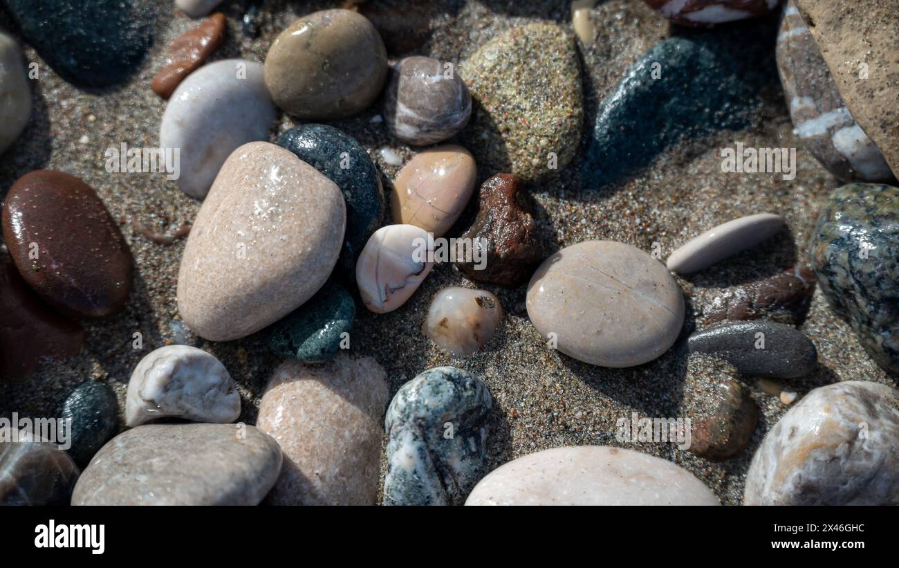 Screensaver with large pebble clods on the sand Stock Photo - Alamy