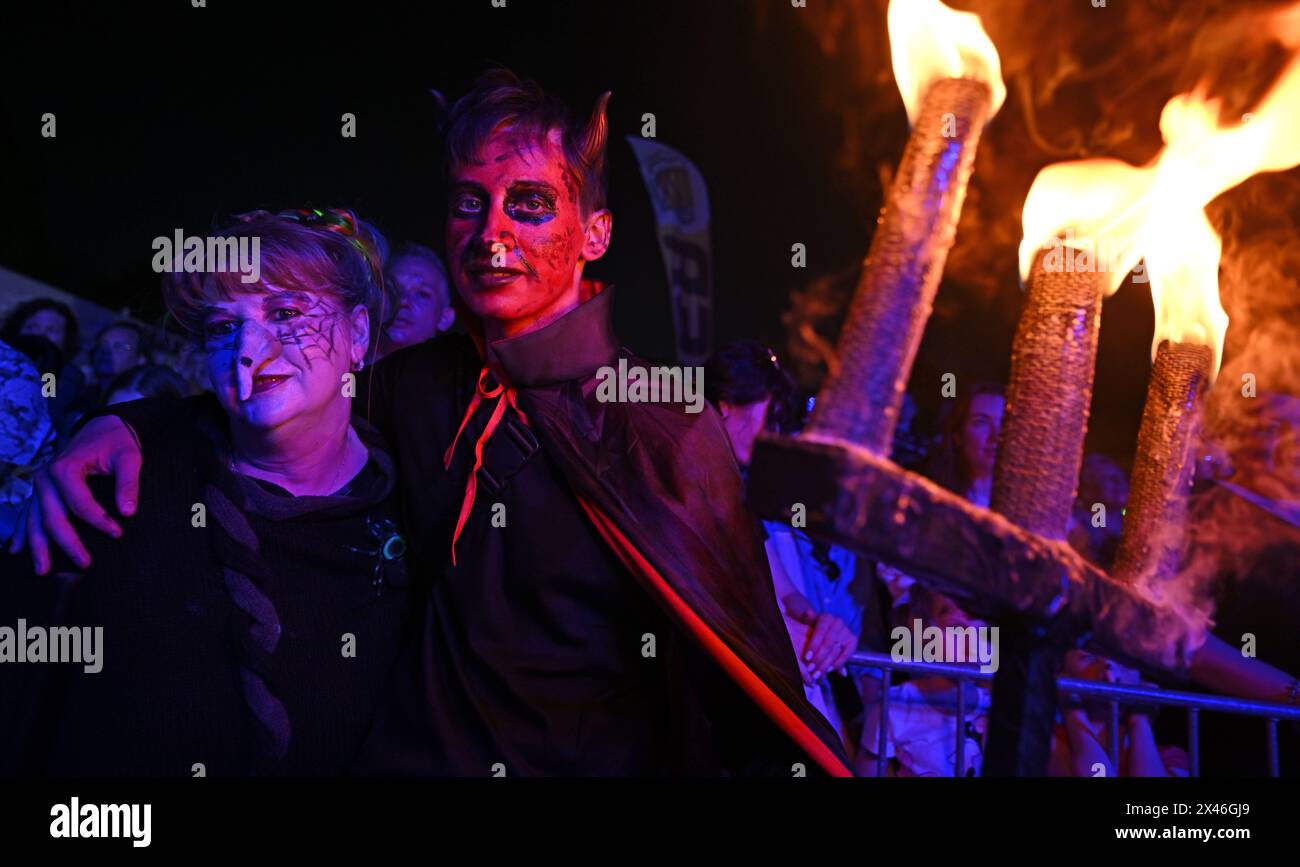 Erfurt, Germany. 30th Apr, 2024. Dressed up as devils and witches ...