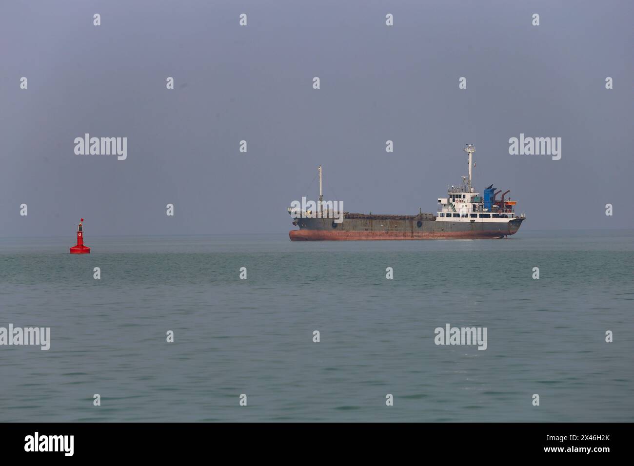 Bushehr, Iran. 29th Apr, 2024. A huge cargo ship is sailing in the ...