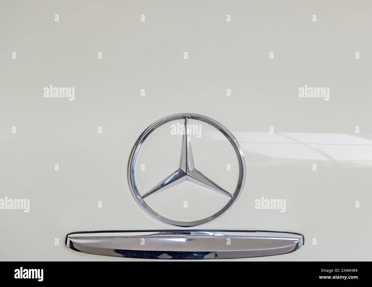 detail image of a three pointed silver star on a 280 sl mercedes's ...
