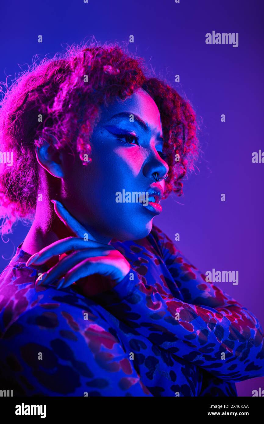 Vibrant African American woman in leopard attire poses confidently ...