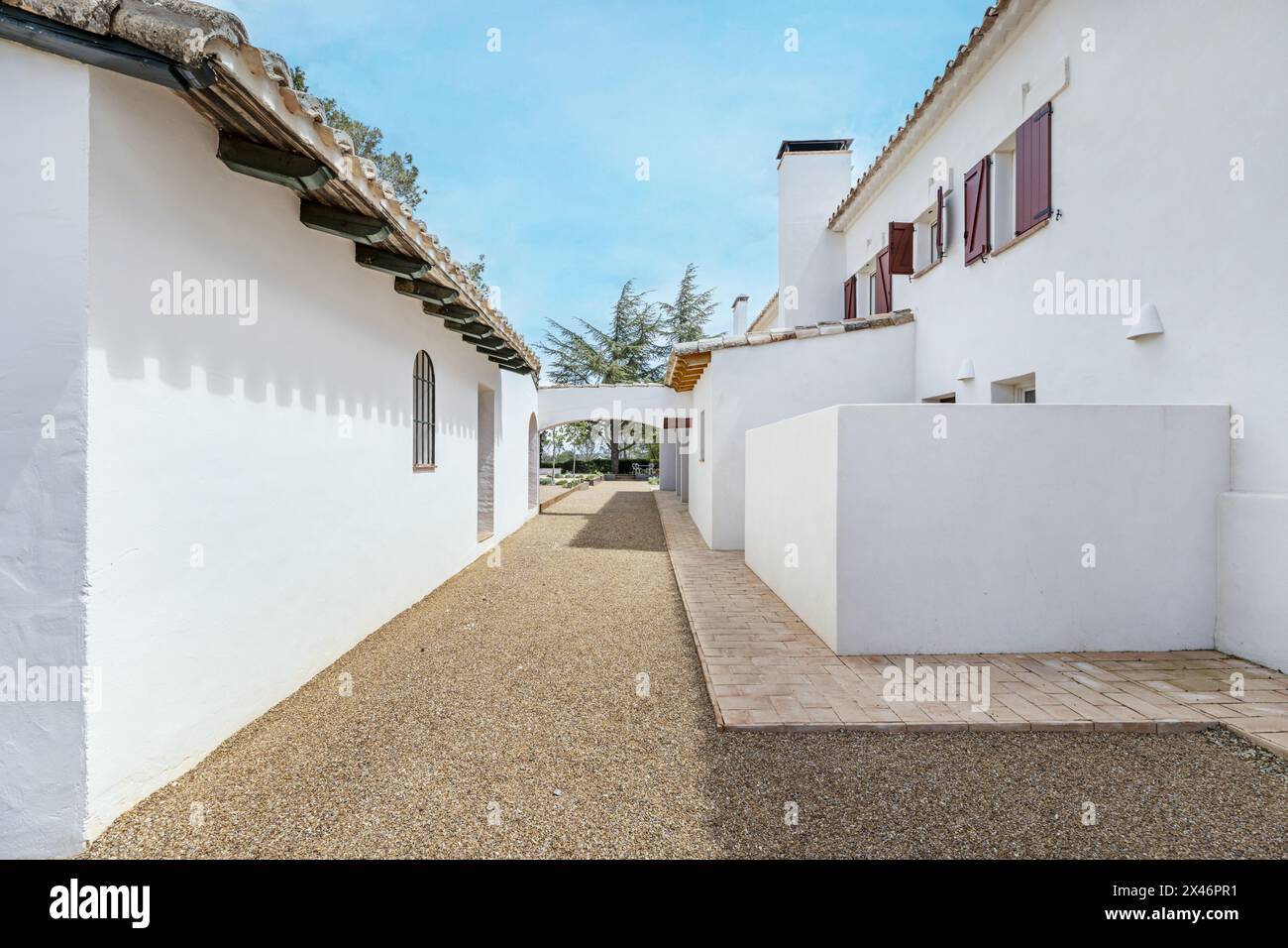 White facades of an Andalusian cortijo style country house with windows ...