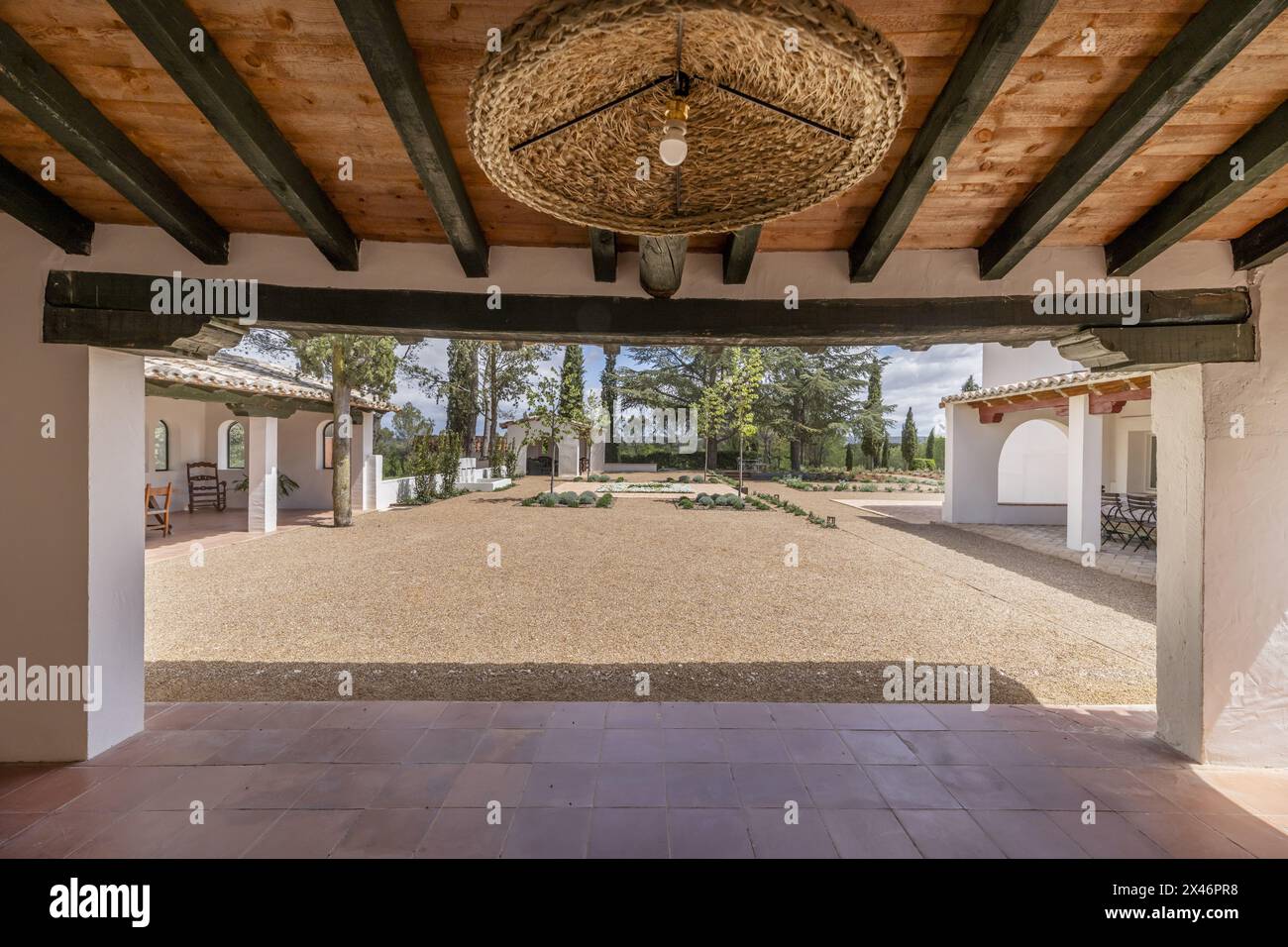 a gallery with wooden ceilings in the patio of an Andalusian farmhouse ...