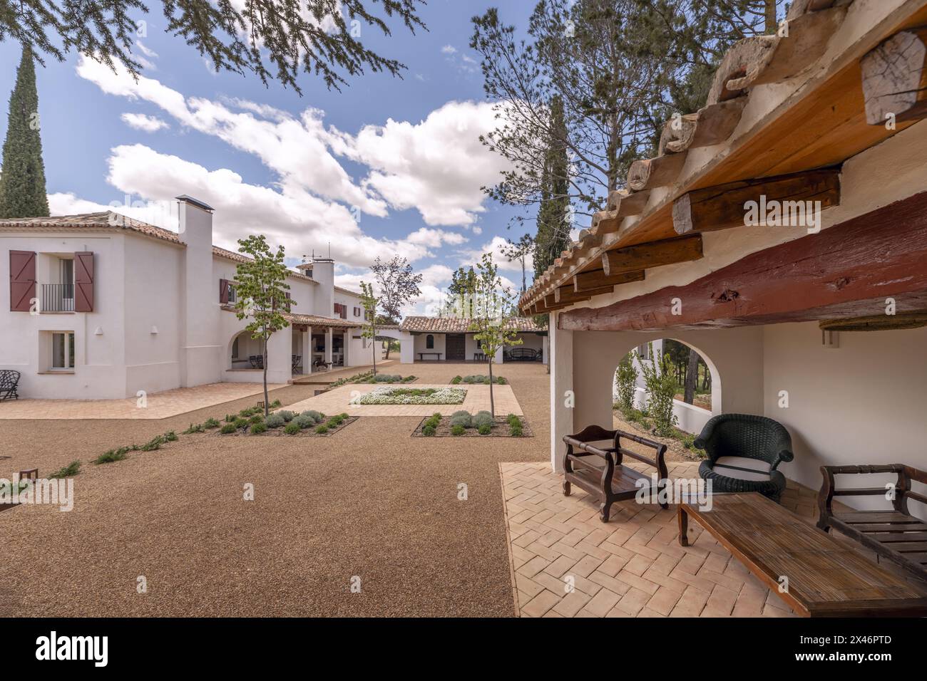Rest areas with seating among gardens with terracotta and gravel floors ...