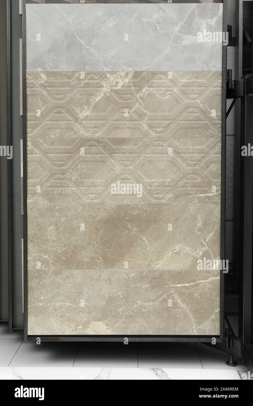 Samples of tiles with different patterns on display in store Stock ...