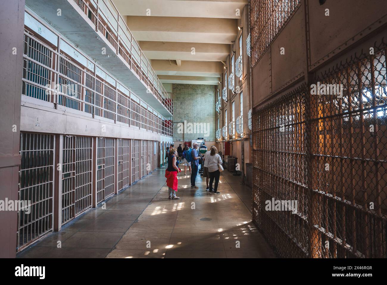 Alcatraz prison interior corridor with empty cells, visitors walking, San Francisco, USA Stock ...