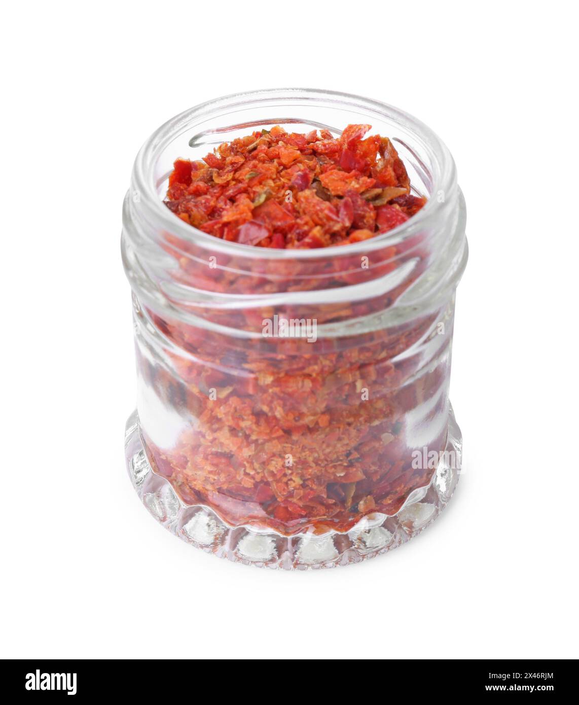 Aromatic spice. Red chili pepper flakes in jar isolated on white Stock ...