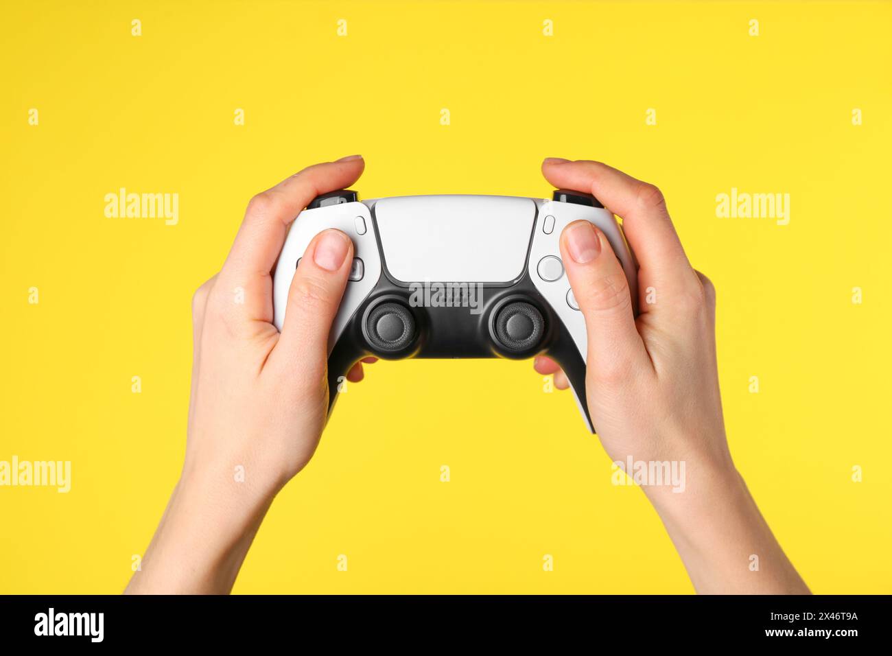 Woman using game controller hi-res stock photography and images - Alamy