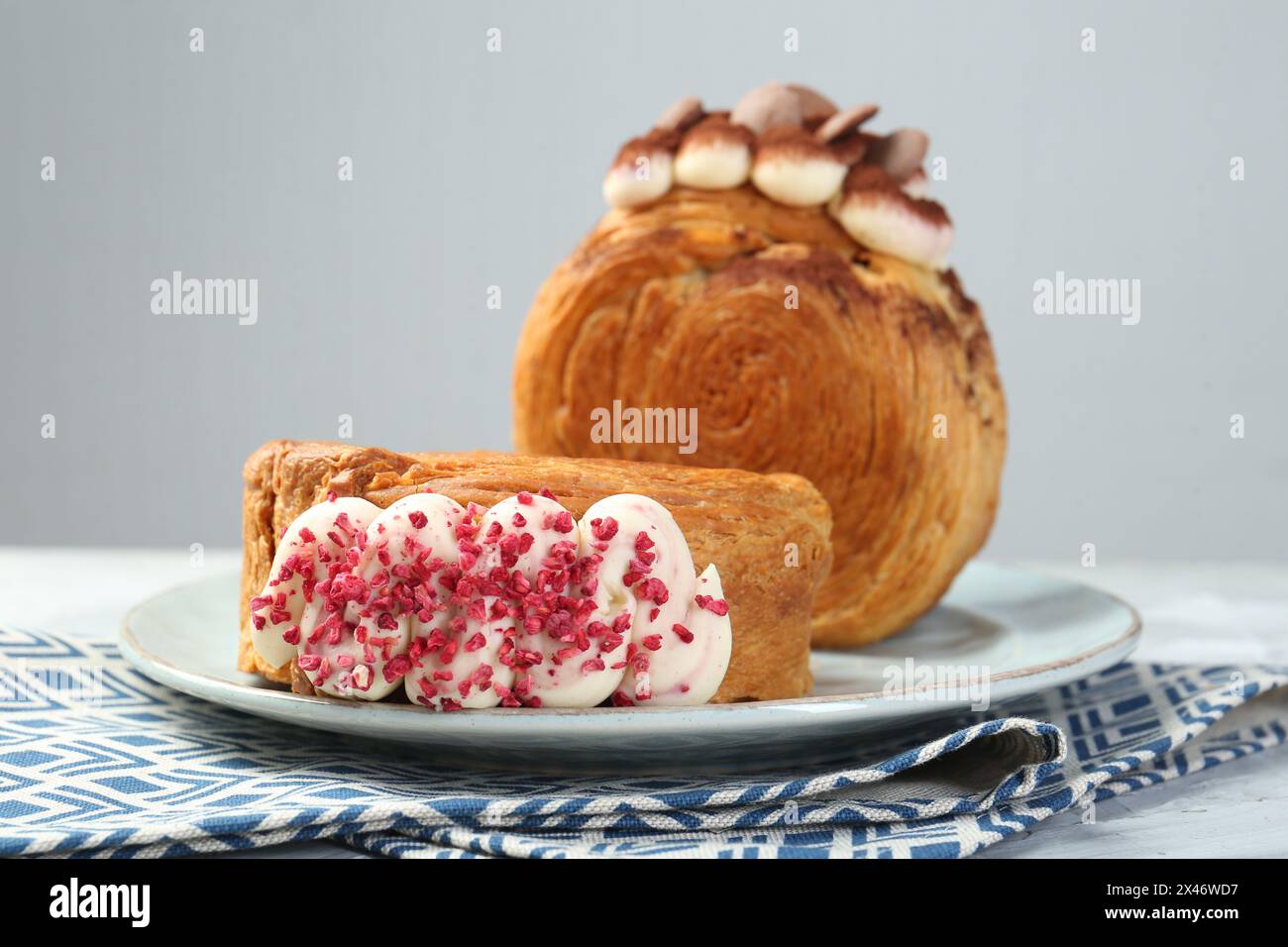 Crunchy round croissants on light table, closeup. Tasty puff pastry ...