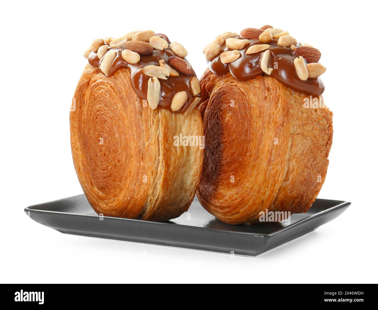 Round croissants with chocolate paste and nuts isolated on white. Tasty ...