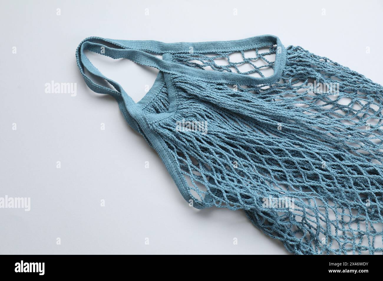 Blue string bag on light grey background, top view Stock Photo - Alamy