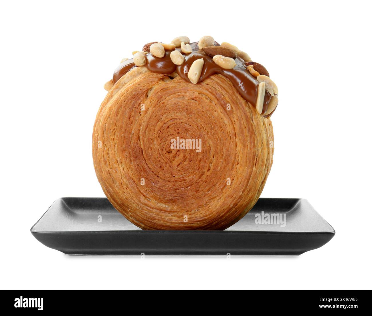 Round croissant with chocolate paste and nuts isolated on white. Tasty ...