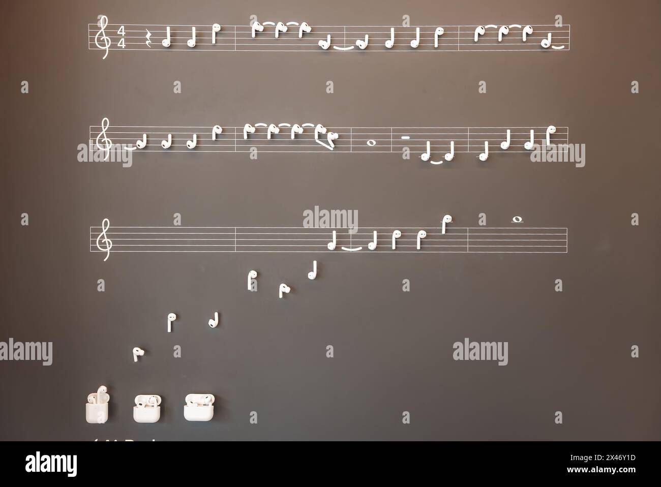 Music notes and rests displayed on staves against plain background ...