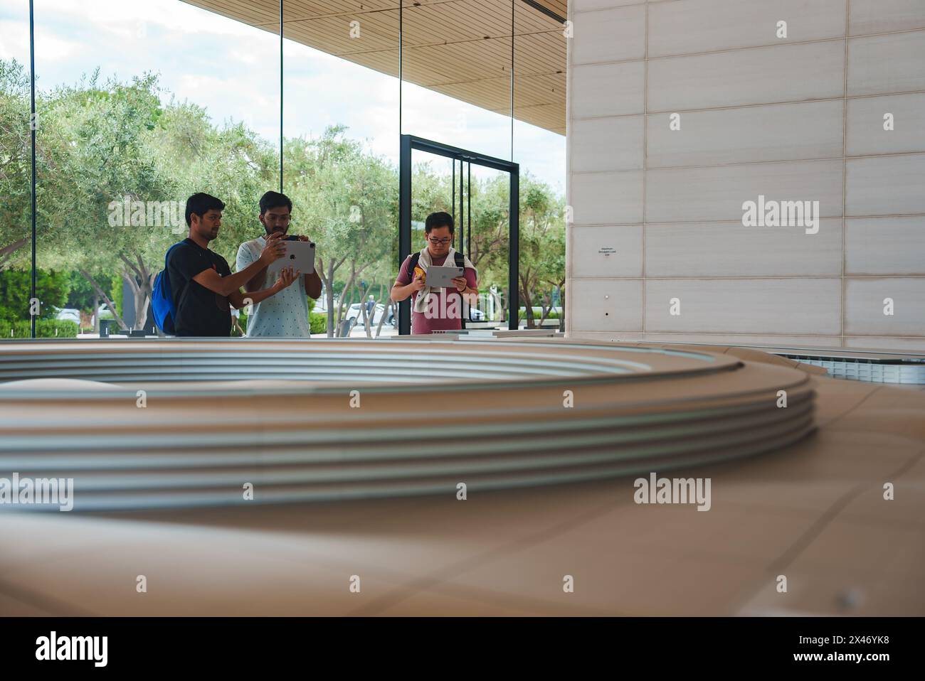 Modern Apple Store Interior with Customers, Product Display, and ...