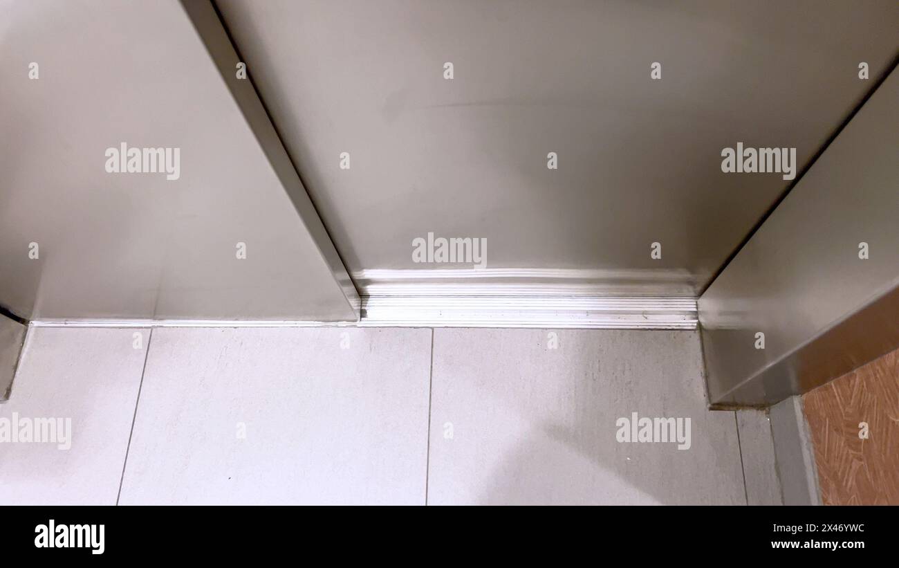 Elevator Threshold and Floor Detail Stock Photo - Alamy