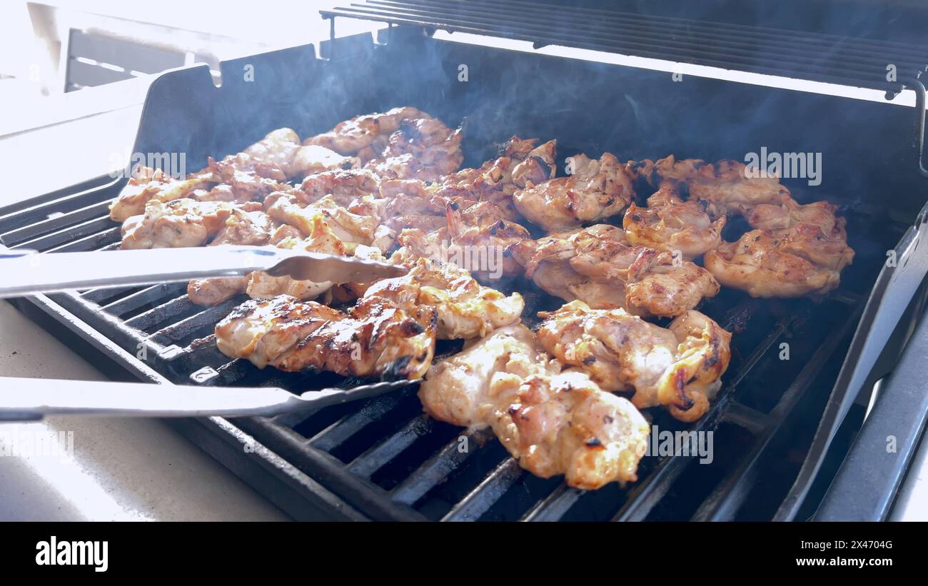 Grilling Marinated Chicken on an Outdoor BBQ Grill Stock Photo - Alamy