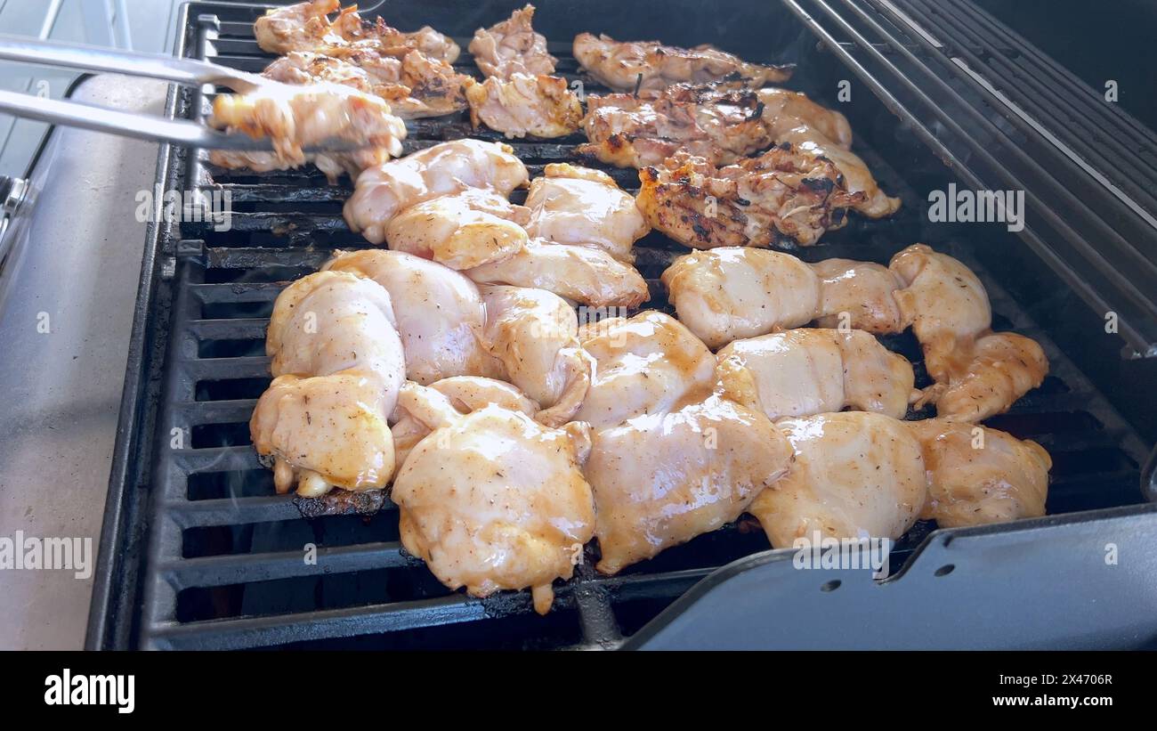 Grilling Marinated Chicken on an Outdoor BBQ Grill Stock Photo - Alamy
