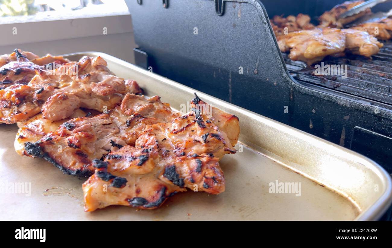 Grilling Marinated Chicken on an Outdoor BBQ Grill Stock Photo - Alamy