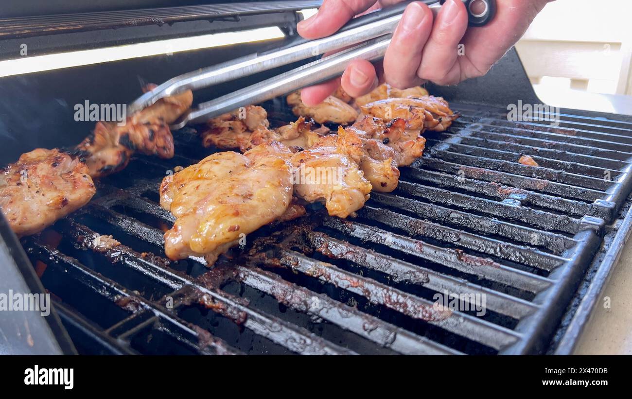 Grilling Marinated Chicken on an Outdoor BBQ Grill Stock Photo - Alamy