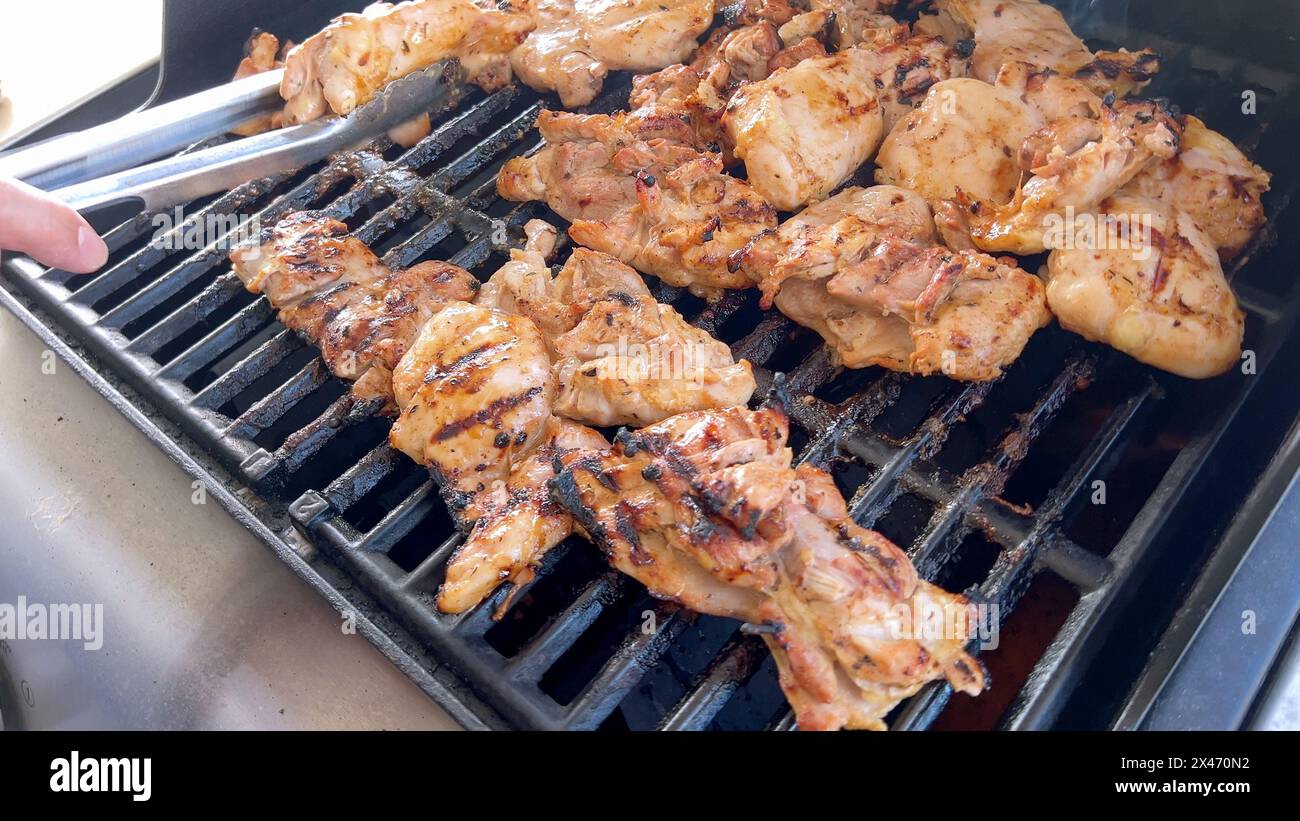 Grilling Marinated Chicken on an Outdoor BBQ Grill Stock Photo - Alamy
