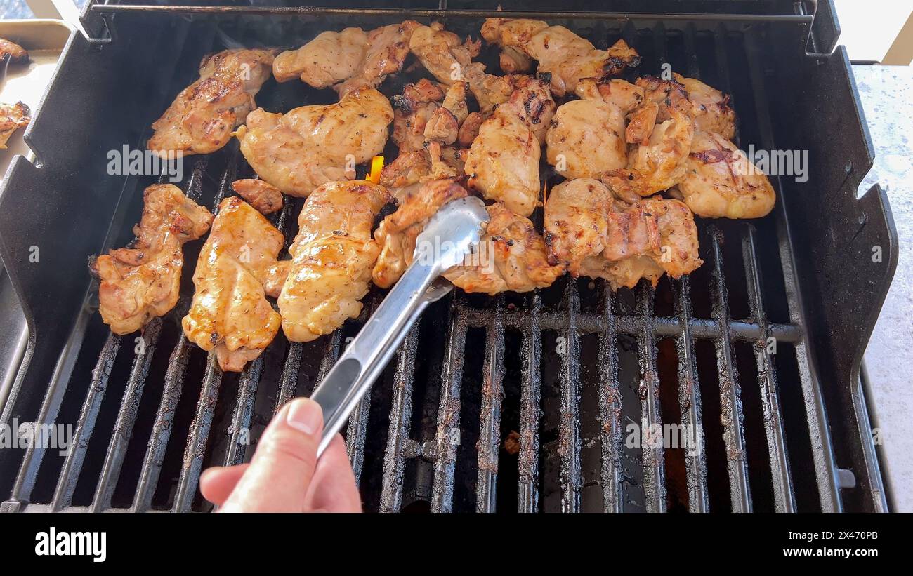 Grilling Marinated Chicken on an Outdoor BBQ Grill Stock Photo - Alamy