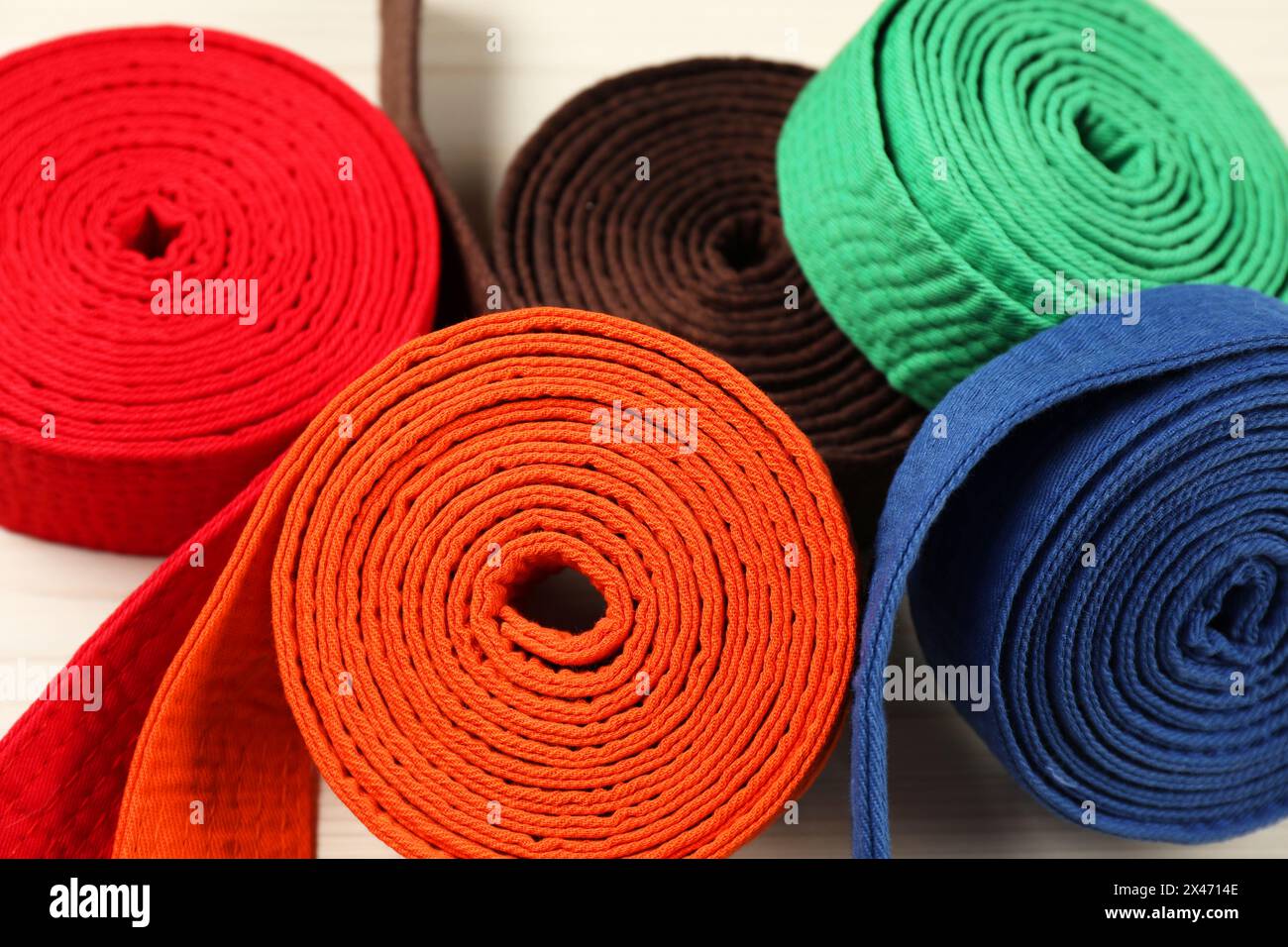 Colorful karate belts, closeup. Martial arts uniform Stock Photo - Alamy