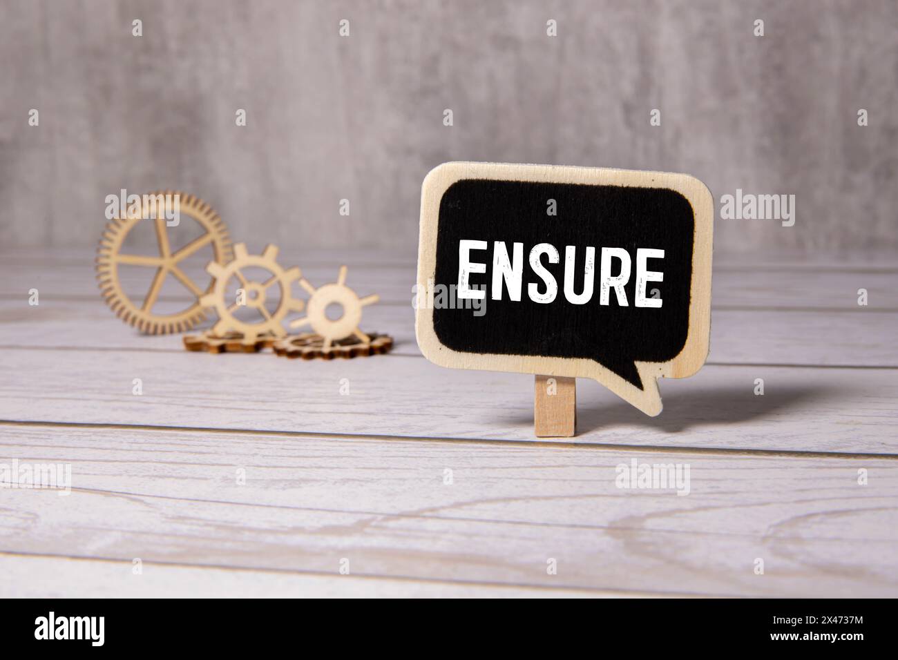 Black color letter in word ensure on white felt board background Stock ...