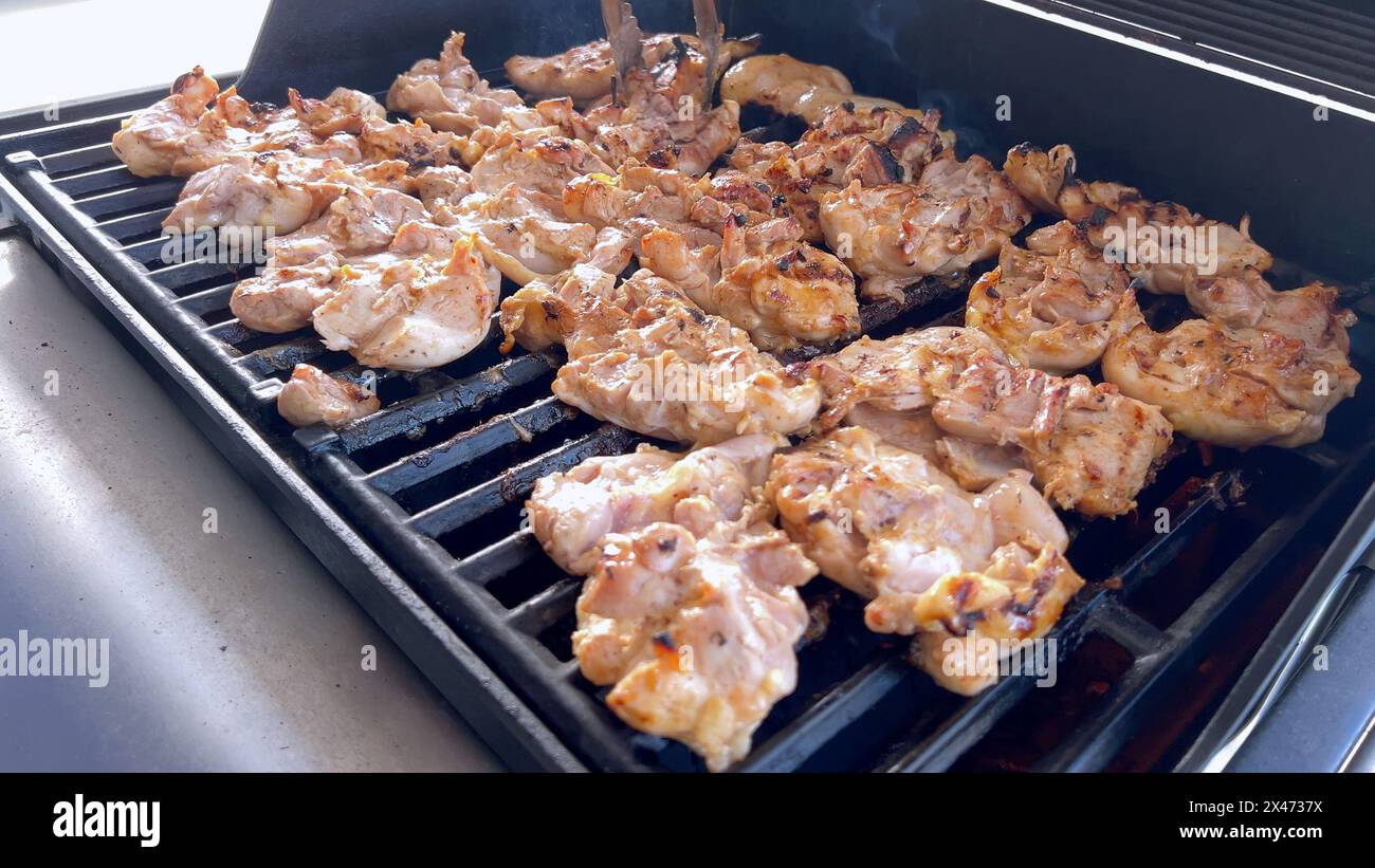 Grilling Marinated Chicken on an Outdoor BBQ Grill Stock Photo - Alamy